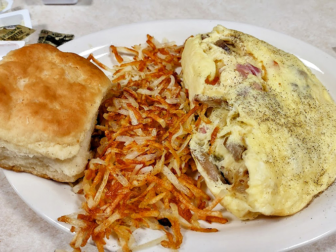 This omelet is what happens when eggs fulfill their highest purpose in life. Paired with crispy hash browns and a fluffy biscuit, it's the breakfast trifecta.