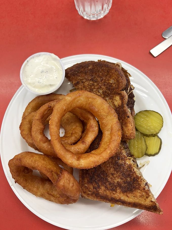 These aren't just onion rings; they're golden halos of happiness. Crispy, light batter giving way to sweet onion that practically melts with each satisfying crunch.
