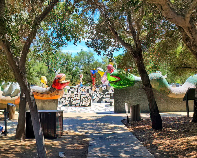 Nature provides the perfect frame for human creativity. The trees bow respectfully to the artistic explosion happening in their midst.