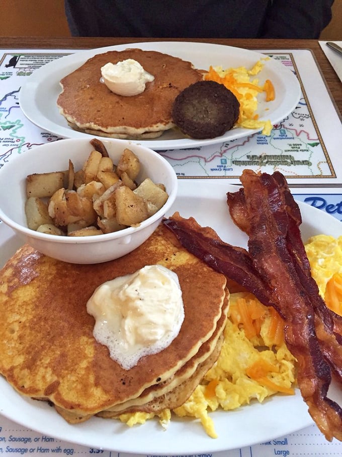 The pancake platter that launched a thousand food comas. Golden flapjacks with a dollop of butter, crispy home fries, and bacon that's achieved perfect crispness.