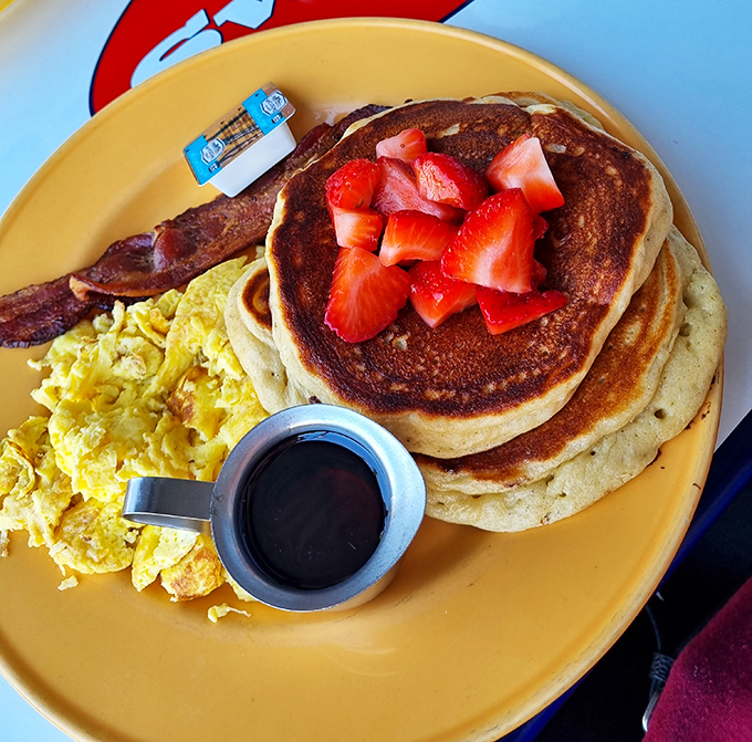 Golden pancakes with fresh strawberries &ndash; the breakfast equivalent of getting an unexpected tax refund and finding a parking spot simultaneously.