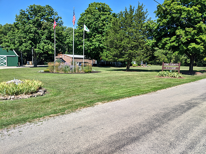 Three flags flutter in the breeze, standing proud like colorful sentinels welcoming travelers to this island sanctuary away from mainland hustle.