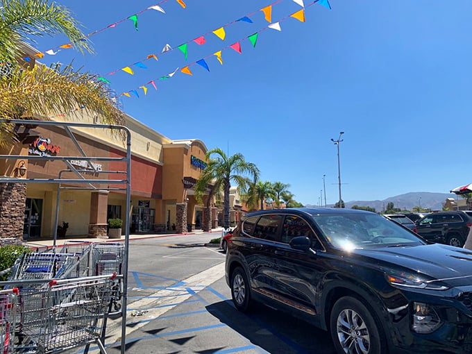 California sunshine bathes the shopping center while colorful pennants flutter overhead&mdash;even the parking lot feels like a fiesta.