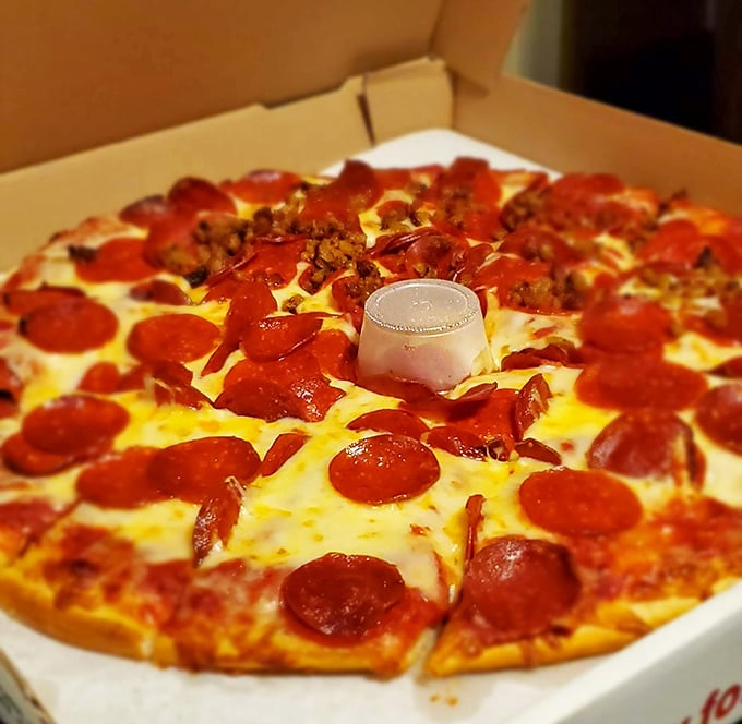 The pepperoni pizza comes with its own dipping sauce centerpiece, like a cheese fountain surrounded by a meaty landscape of deliciousness.