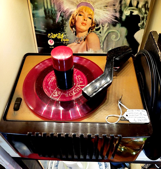 That red vinyl record spinning atop this vintage player isn't just music&mdash;it's a portal to sock hops and soda fountains.