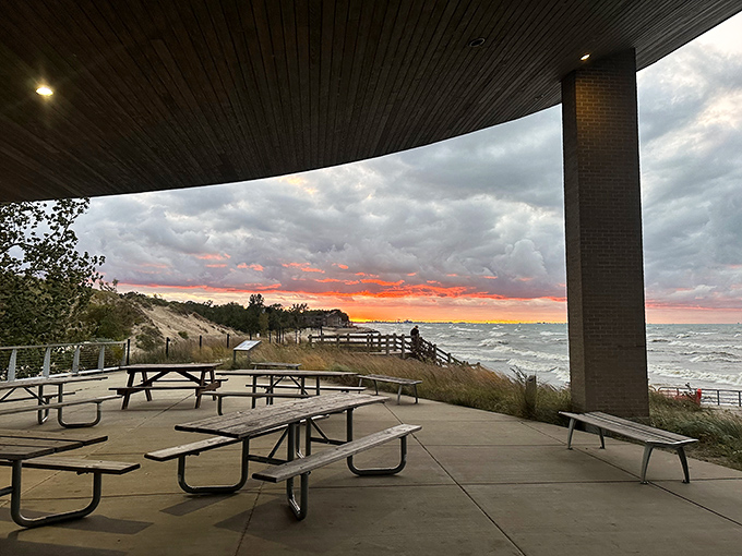 Sunset transforms the pavilion's picnic area into nature's dinner theater, with Lake Michigan providing the ever-changing backdrop.