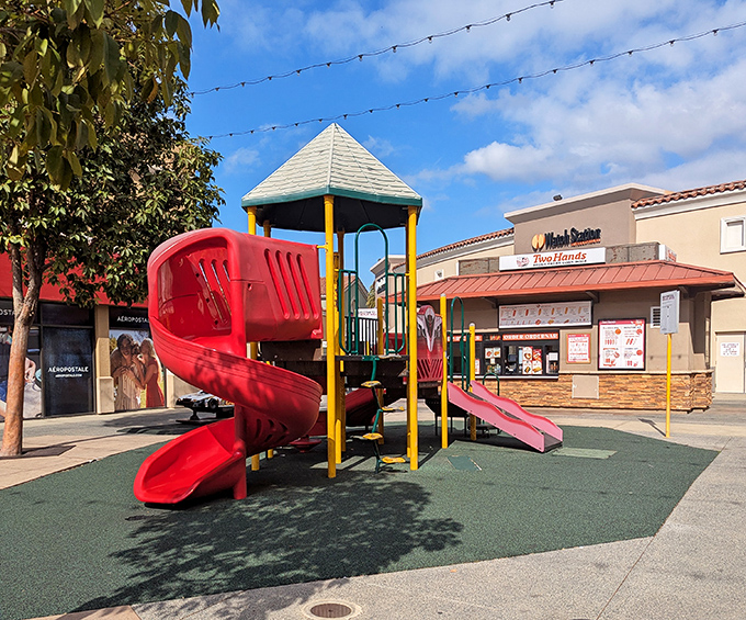 The unsung hero of outlet shopping &ndash; a playground oasis where kids burn energy while adults contemplate one more lap around the Nike store.
