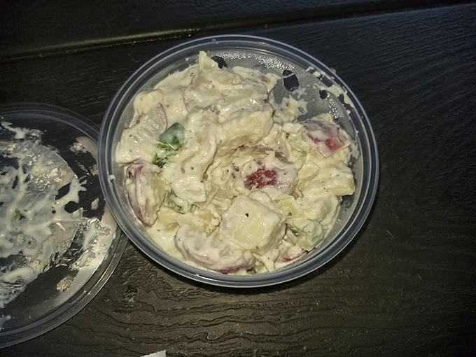 Potato salad that looks like someone's grandmother made it with love and secret ingredients. This isn't a side dish&mdash;it's the supporting actor that steals the show.