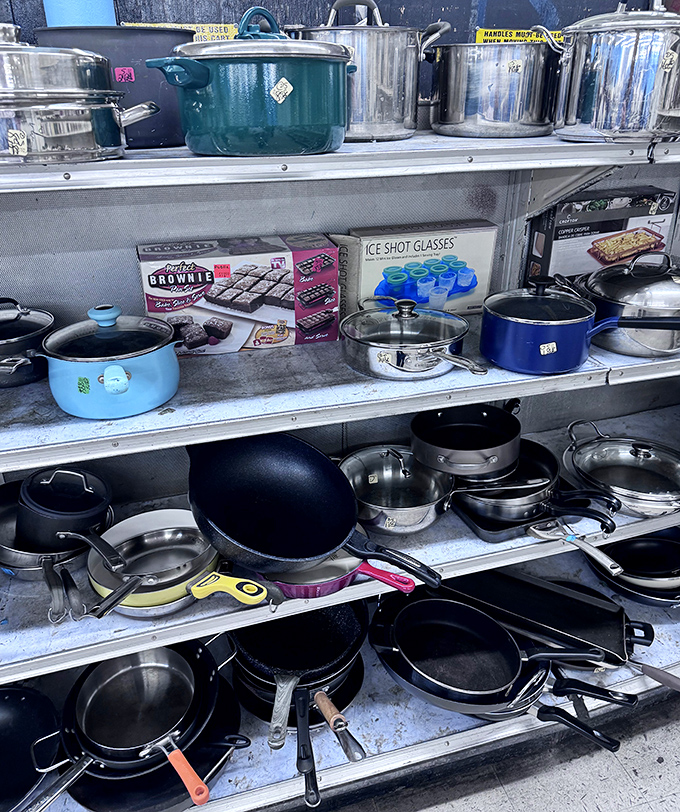 Pots, pans, and kitchen dreams stacked three shelves high. Someone's abandoned brownie maker could become your family's Sunday tradition machine.