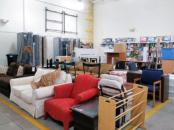 Furniture arranged like a living room vignette&mdash;that red accent chair is practically begging to brighten someone's reading nook.
