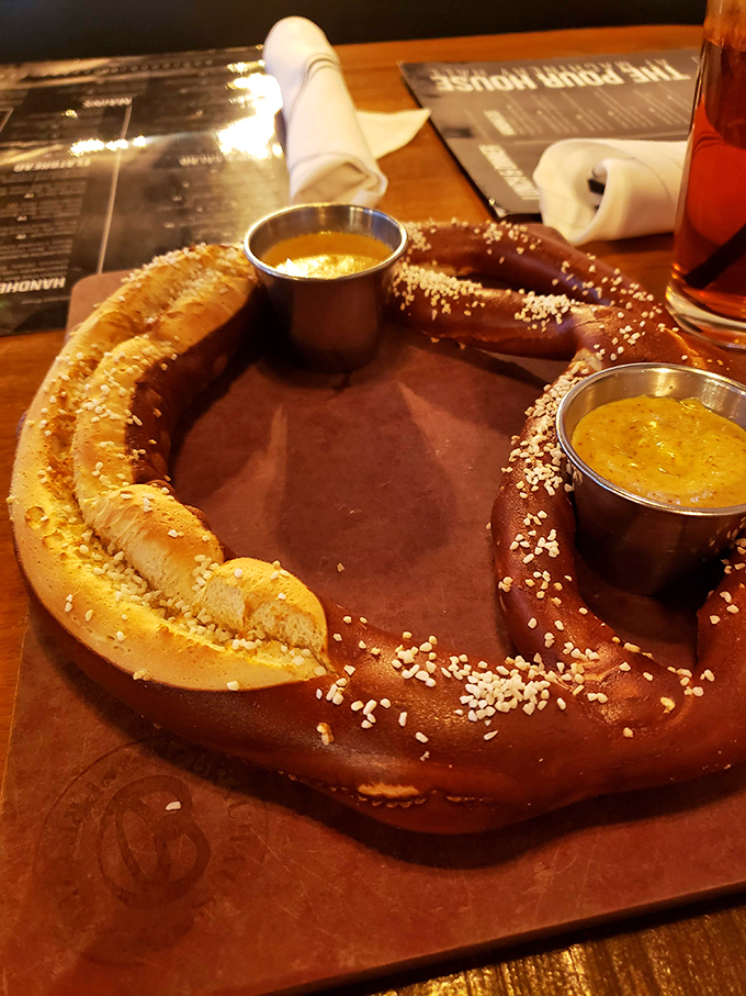 This isn't your ballpark pretzel. This magnificent, salt-kissed beauty with beer cheese dip is what carb dreams are made of.