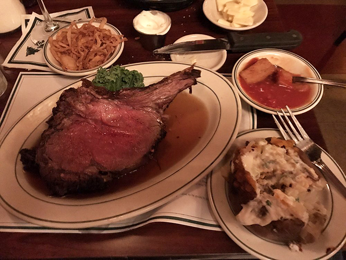 Prime rib that would make your cardiologist wince and your taste buds sing, accompanied by sides that refuse to be overshadowed.