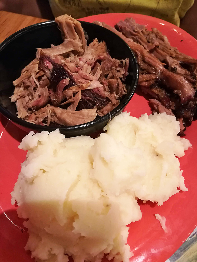 Pulled pork that's clearly been introduced to smoke and spice before being gently coaxed apart, accompanied by mashed potatoes smooth enough to make you weep.
