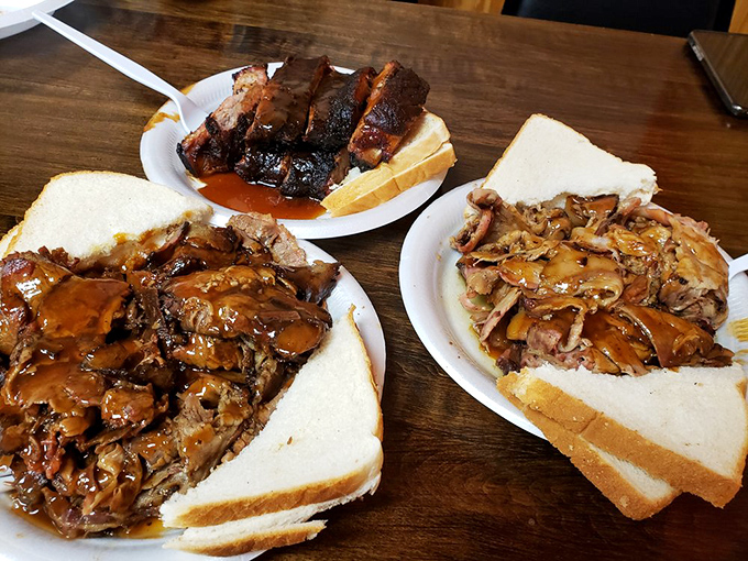 Three pulled pork sandwiches that showcase Memphis barbecue artistry. The bread knows its role &ndash; supporting the star without stealing the spotlight.