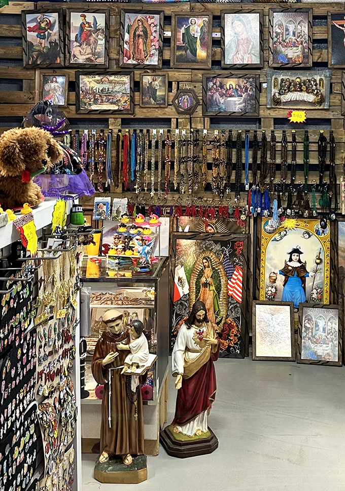 A spiritual corner where faith meets folk art. These religious statues and paintings create a reverent gallery amid the market's cheerful chaos.