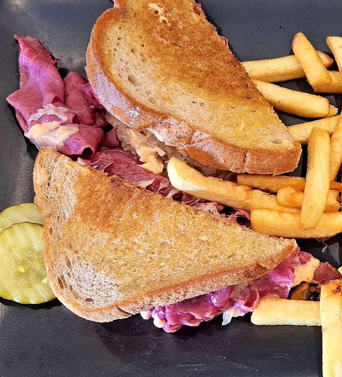 The Reuben sandwich&mdash;where corned beef, sauerkraut, and melted cheese create a symphony that makes you forget you're sitting in Kissimmee, not Manhattan.
