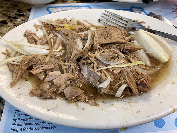 Slow-roasted pork that's been cooked with more patience than a saint, resulting in meat that practically melts on contact.