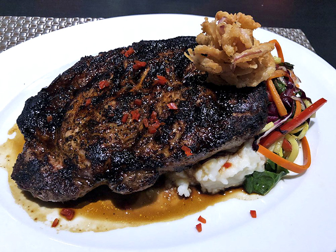 The coffee-rubbed ribeye arrives like a rock star on stage—dramatic, commanding attention, and leaving you wanting an encore.