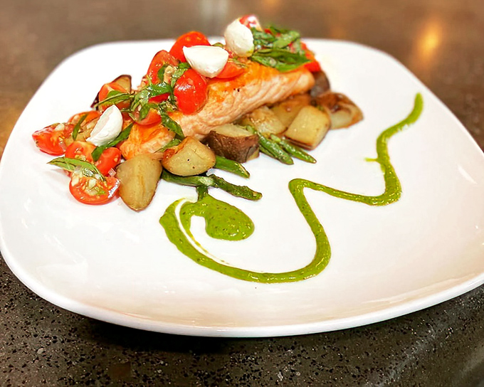 Salmon with cherry tomatoes and herbs transforms simple ingredients into restaurant-worthy artistry at home.