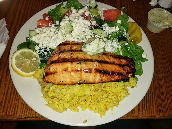 Salmon that's grilled with such precision it makes you wonder if there's a fish whisperer hiding in the kitchen. The char marks tell stories.