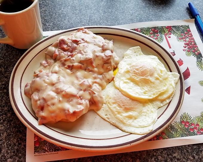 Sausage gravy with sunny-side-up eggs - the breakfast equivalent of a warm hug from someone who truly cares about your happiness.
