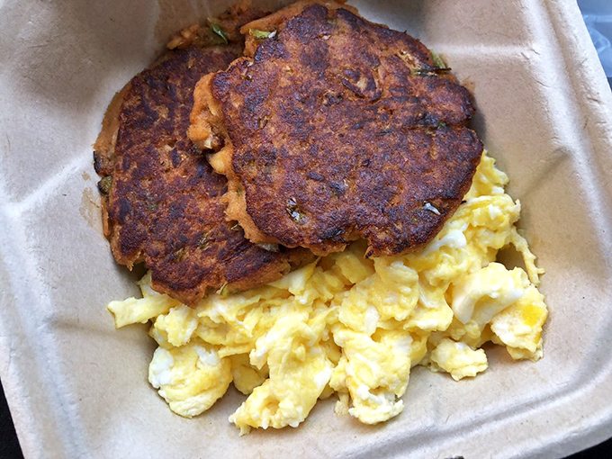 These aren't just sausage patties &ndash; they're edible hockey pucks of happiness, seasoned to perfection and nestled beside fluffy scrambled eggs.