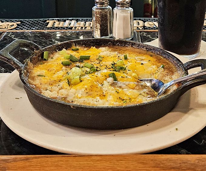 Bubbling cheese atop a skillet of comfort &ndash; this isn't just food, it's a warm hug after a long day in edible form.