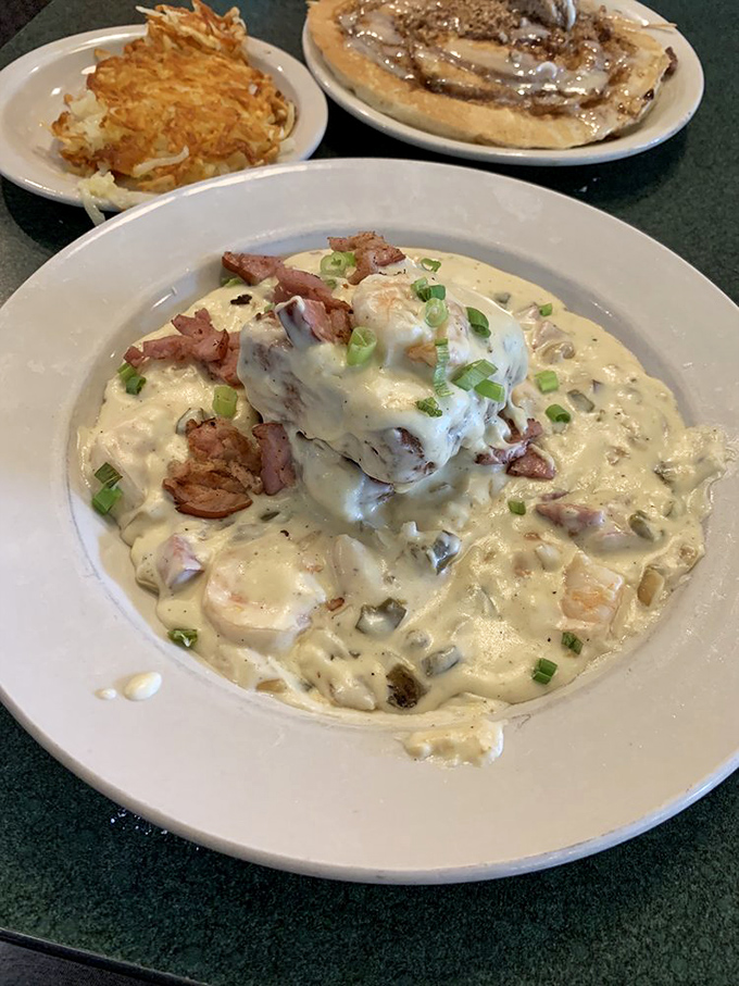 Shrimp and grits elevated to an art form. Creamy, savory, and topped with enough green onions to make your breath memorable for hours.