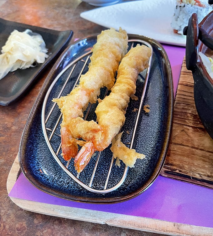 Tempura shrimp so perfectly fried, they look like they're wearing golden evening gowns to a seafood gala.