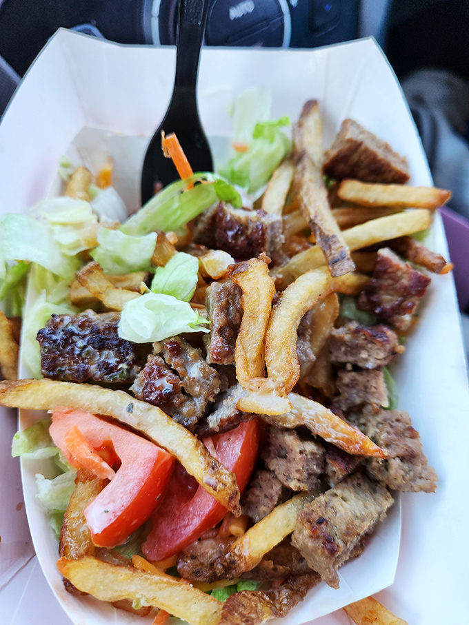 The sirloin steak salad transforms healthy eating into an adventure, topped with perfectly grilled meat and crispy fries.