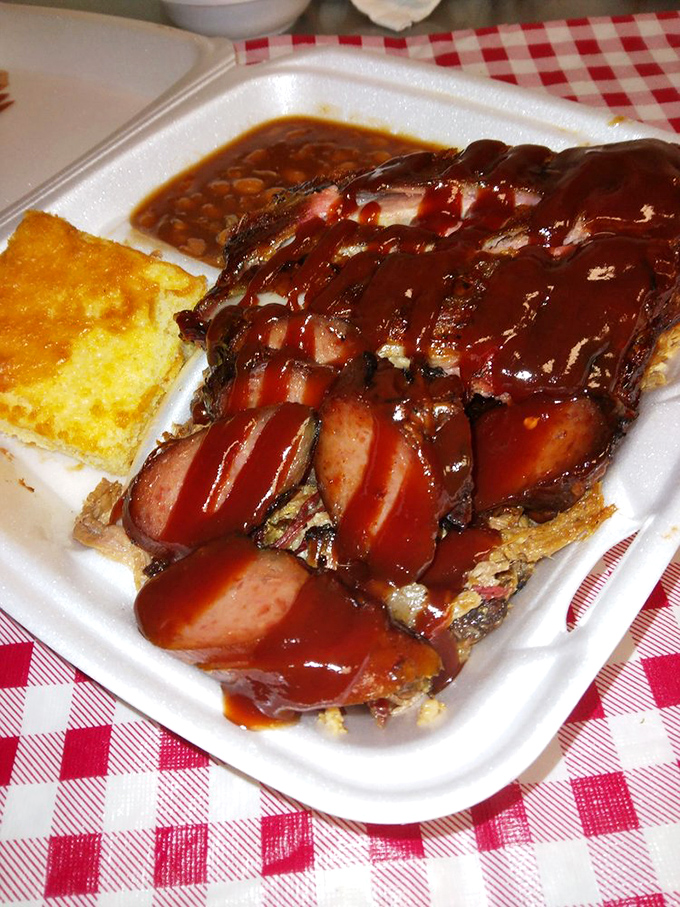 When barbecue sauce cascades over perfectly smoked sausages like this, you don't just eat lunch&mdash;you experience a meat epiphany. The cornbread is just there for moral support.