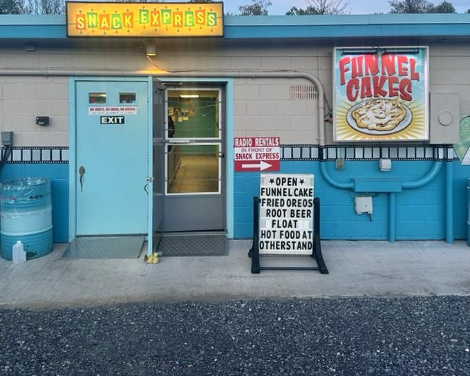 The Snack Express window glows invitingly, offering funnel cakes and fried treats that diet books warn against.