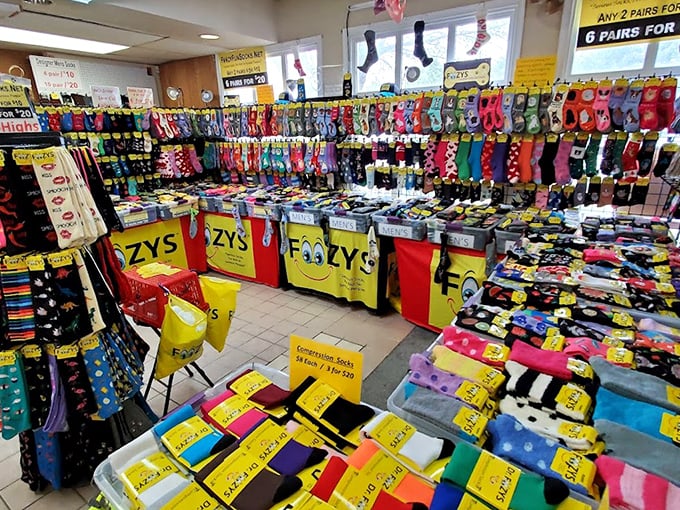 The sock vendor's rainbow display could make even Marie Kondo question minimalism. More patterns than a kaleidoscope factory and enough options to change daily for a year.