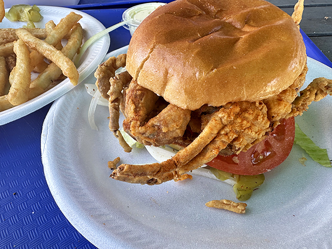 Soft shell crab gets the royal treatment it deserves between two perfectly toasted bun halves.