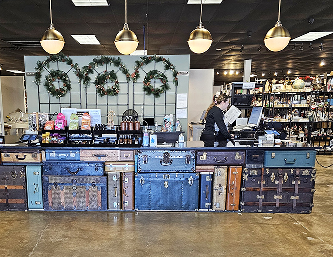 The checkout counter cleverly constructed from vintage suitcases&mdash;because even the practical elements here tell stories of journeys past.