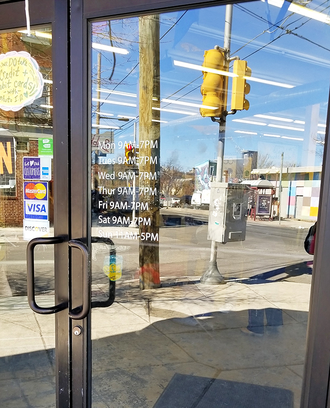 The store hours posted clearly on the door&mdash;because treasure hunting requires proper planning and timing.