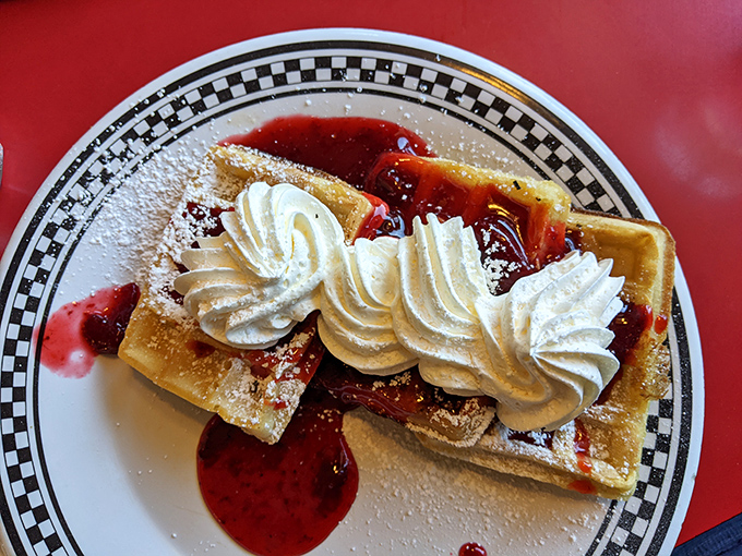 Breakfast dessert masquerading as a legitimate meal&mdash;waffles crowned with whipped cream and strawberry sauce that make Monday mornings bearable again.