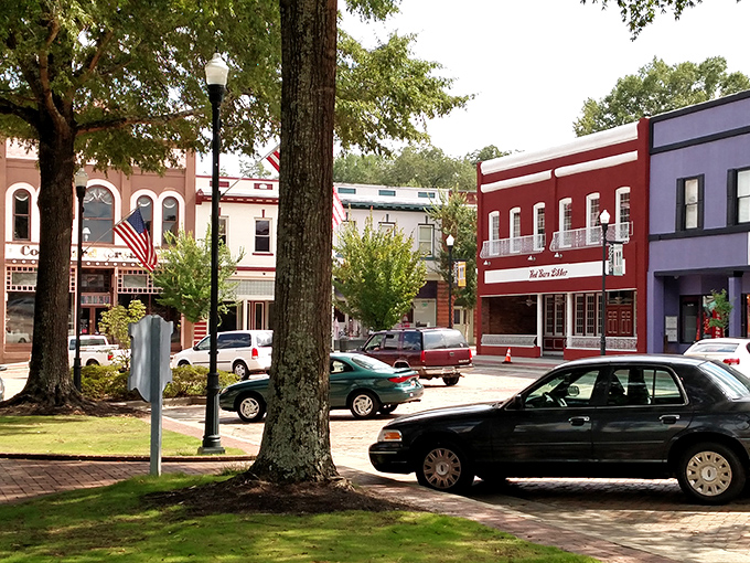 Colorful storefronts frame Abbeville's square like a painter's palette. Each building tells a story&mdash;no cookie-cutter chain stores in this visual feast.