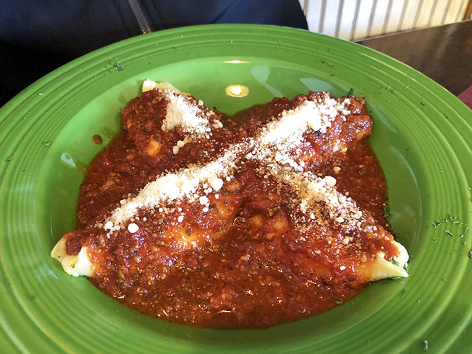 Stuffed peppers that look like they're auditioning for a food magazine cover&mdash;vibrant green shells cradling a savory filling under a blanket of marinara.