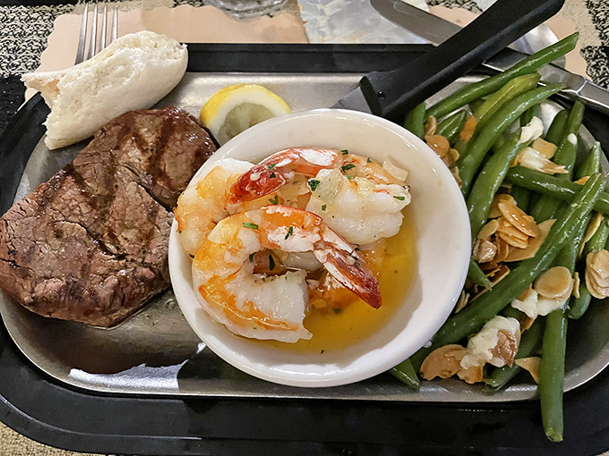 The ultimate land-and-sea alliance: tender steak, buttery shrimp, and green beans almondine. Diplomacy never tasted this good.