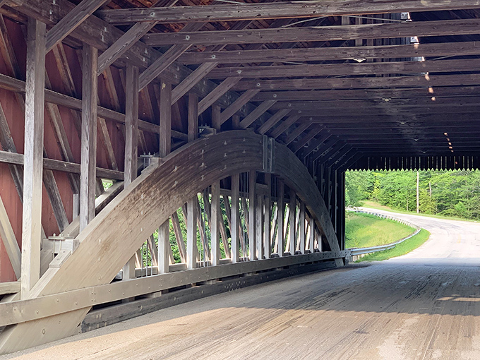 The elegant timber arch isn't just beautiful&mdash;it's engineering genius disguised as rustic simplicity, supporting travelers for generations.