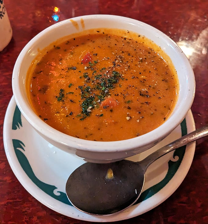 This isn't just soup&mdash;it's liquid comfort in a bowl, with herbs floating like tiny flavor rafts in a sea of tomato goodness.