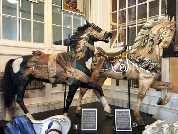 These magnificent steeds showcase different carving styles—one wild and spirited, the other regal and composed. Horse personalities, immortalized in wood.