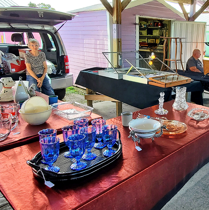 Cobalt blue glassware catches the morning light at this vintage housewares booth. Grandma's dining table never looked this good.