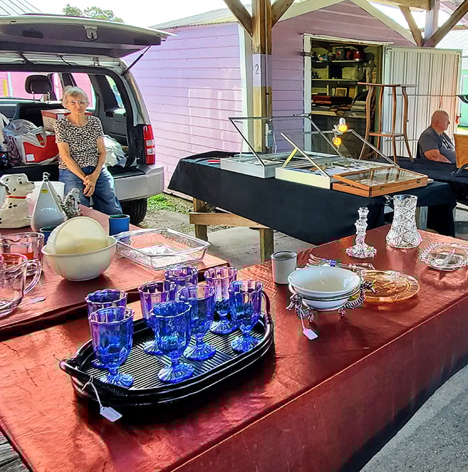 Cobalt blue glassware catches the morning light at this vintage housewares booth. Grandma's dining table never looked this good.
