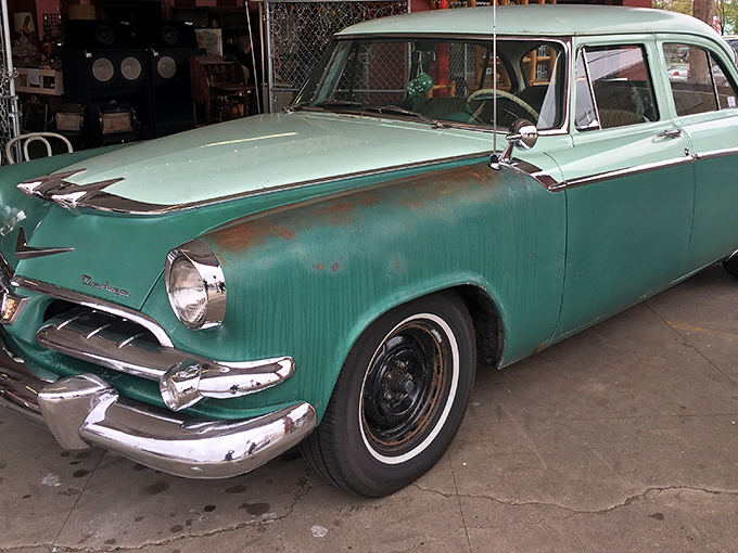 This mint-green vintage beauty isn't just a car&mdash;it's automotive poetry from an era when dashboards gleamed and tail fins reigned supreme.