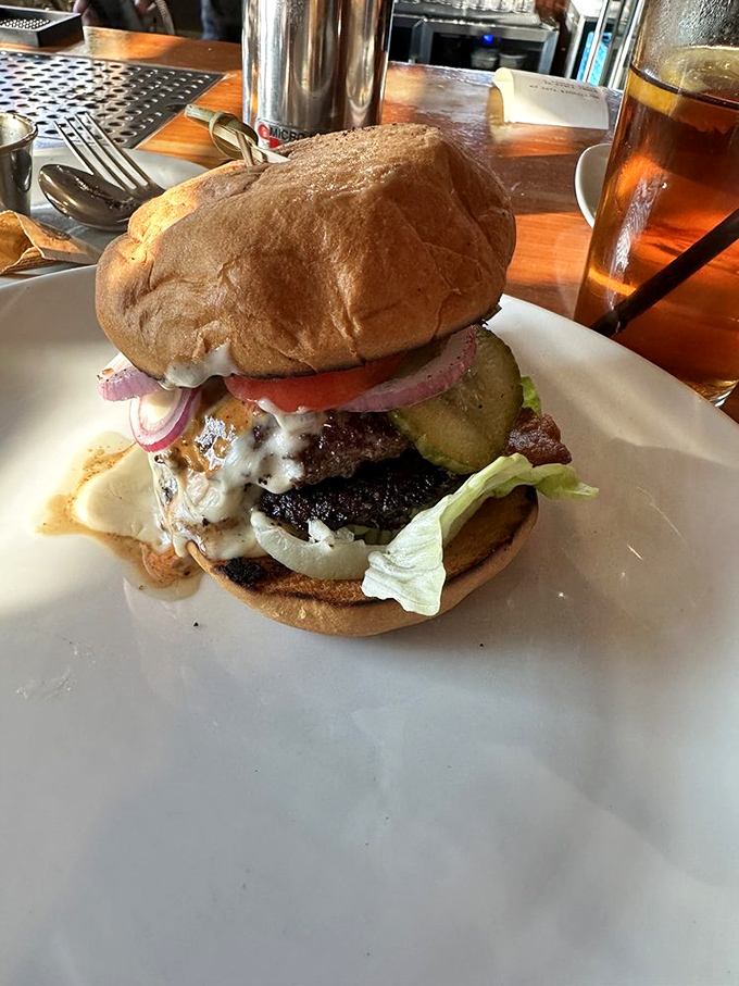 The Wagyu burger—where beef transcends mere sandwich status and becomes a religious experience between two buns.