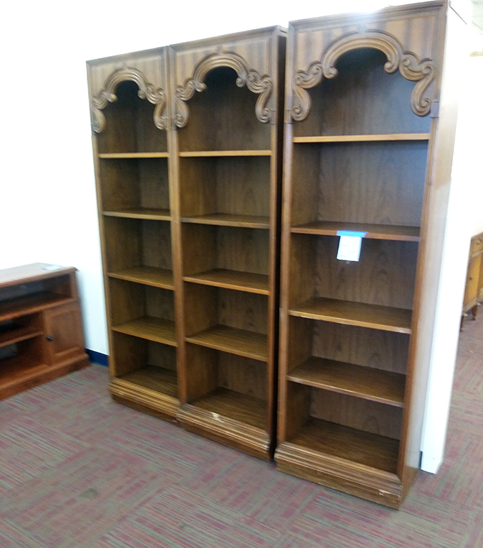 These ornate wooden bookshelves aren't just furniture&mdash;they're waiting libraries ready to showcase your impressive collection of unread books.