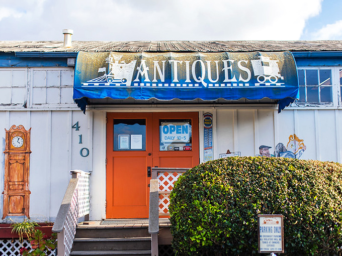 A storybook entrance with an orange door that might as well say "Once Upon a Time" instead of "Open."