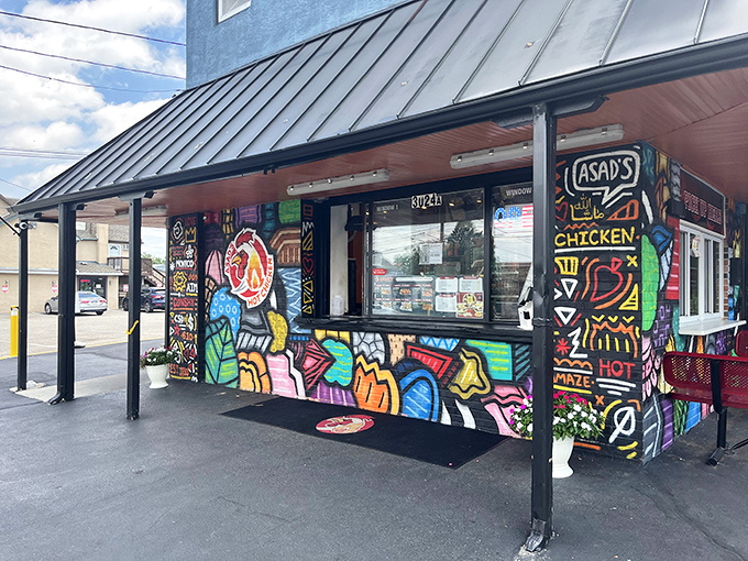 Asad's vibrant exterior murals are just a preview of the flavor explosion waiting inside. Hot chicken that's as colorful as its building!